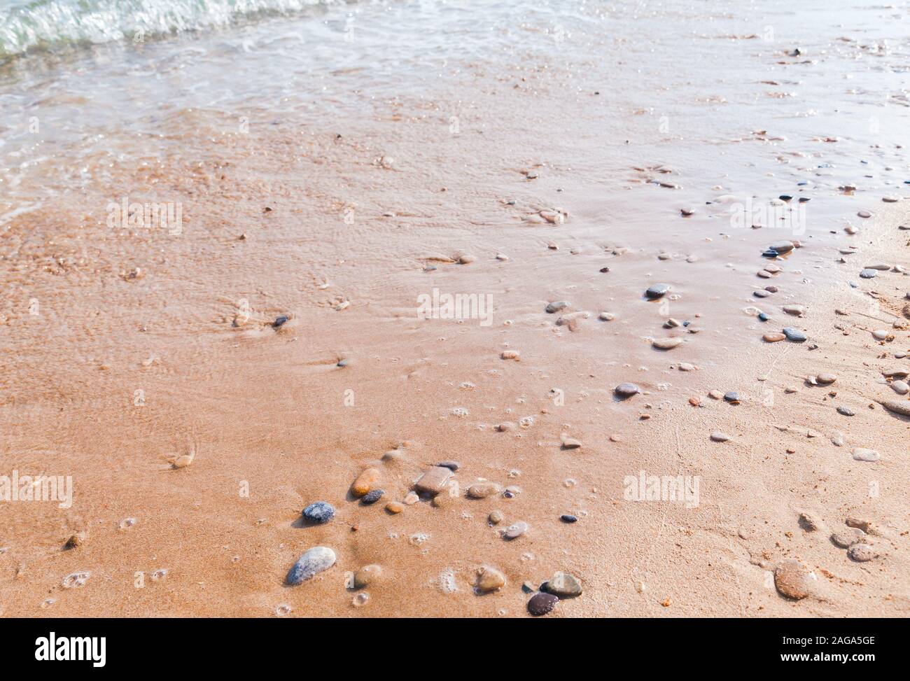 Sandy beach ground with pebble, wet sea coast, natural background photo ...