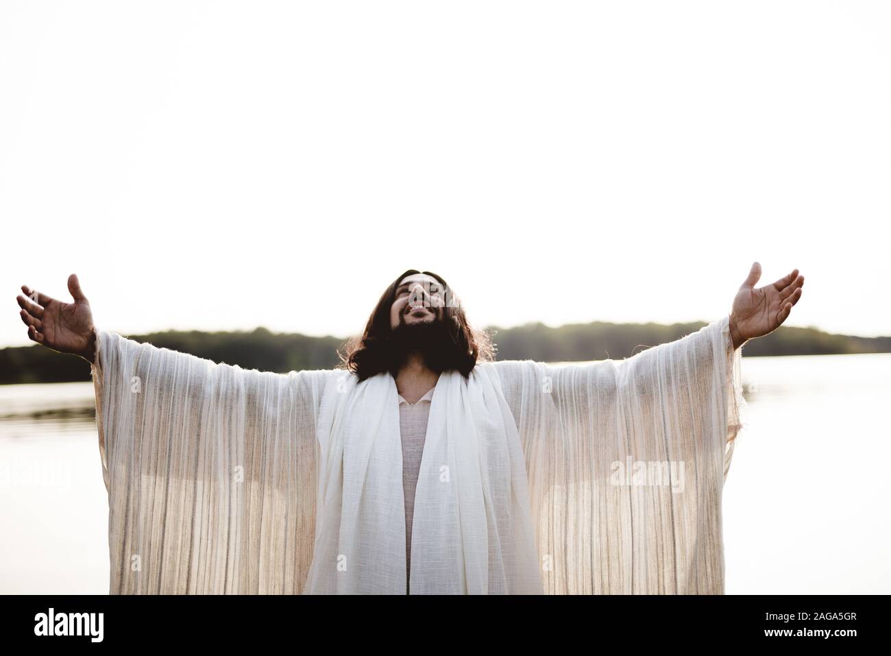 Jesus Christ with his hands towards the sky Stock Photo - Alamy