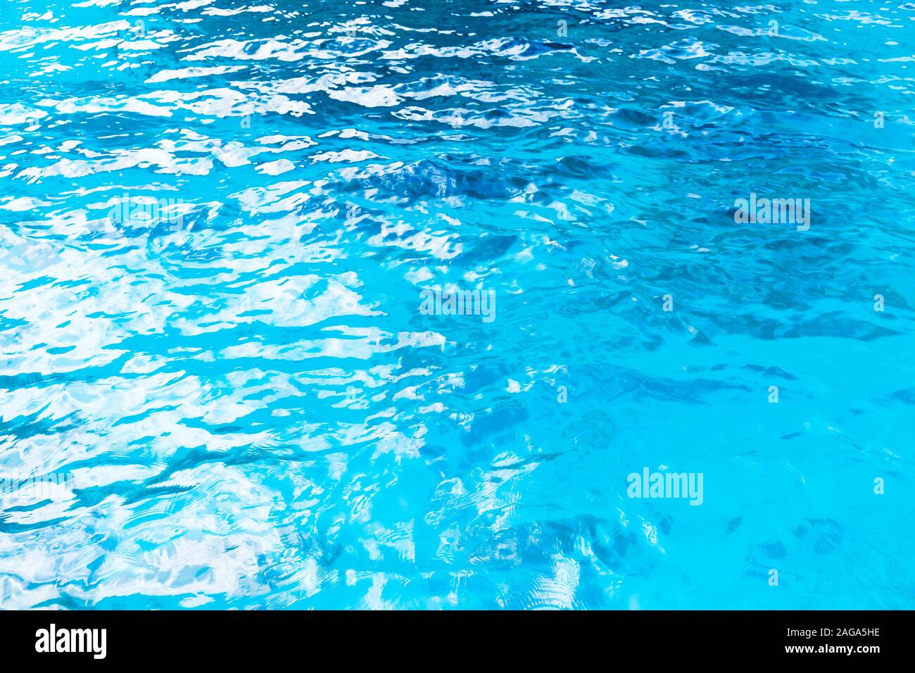 Clear shiny blue ocean water surface. Natural background photo texture ...