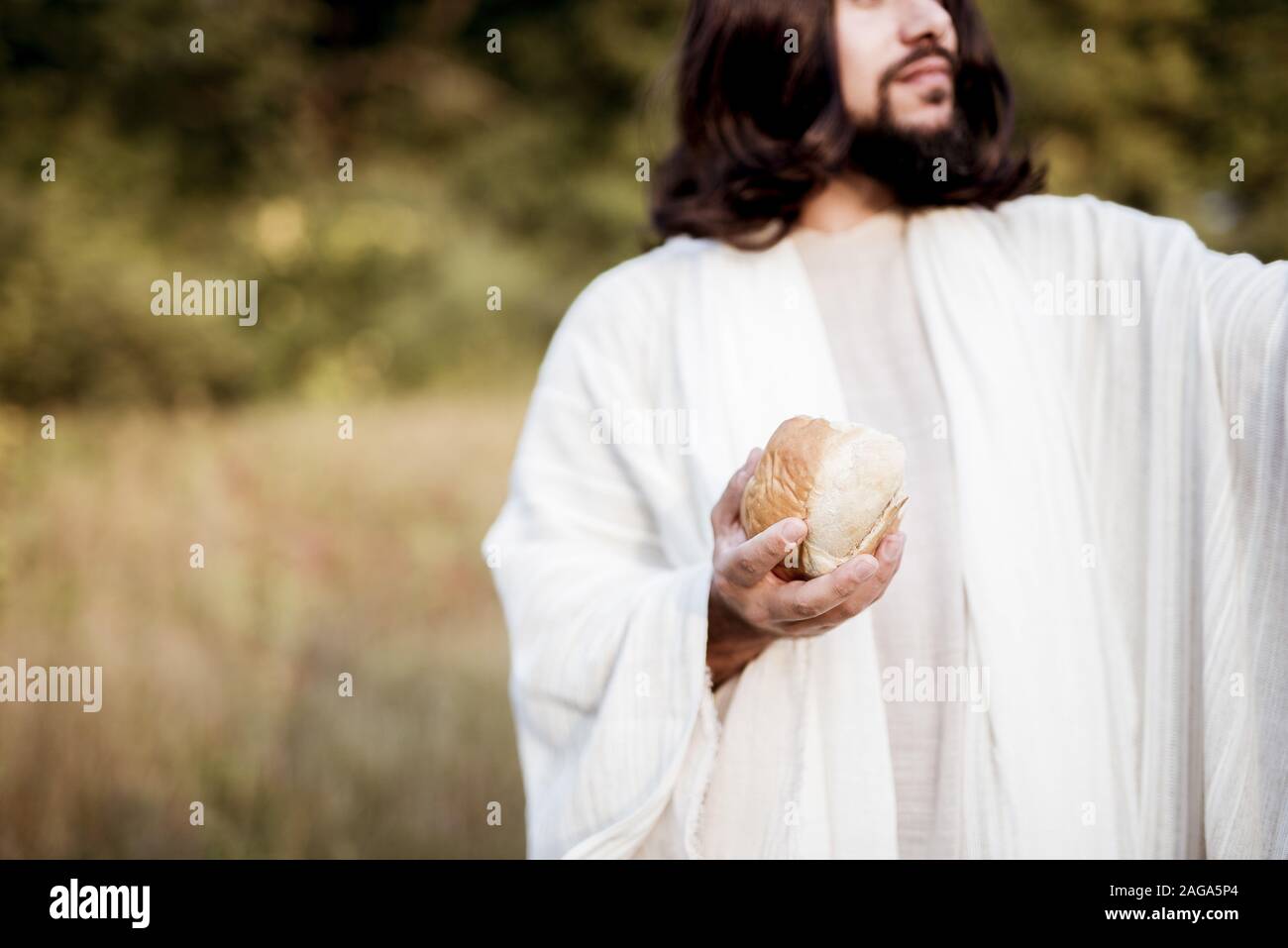 Jesus Christ giving out the sliced bread Stock Photo - Alamy