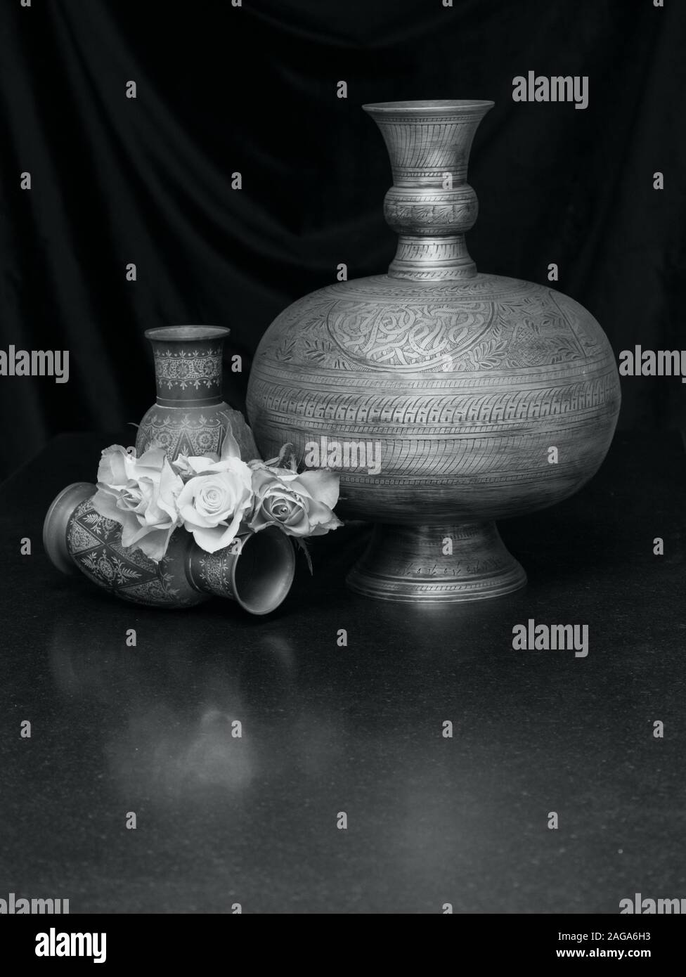 Classical Monochrome still Life setting with Roses, Brass and Copper ...