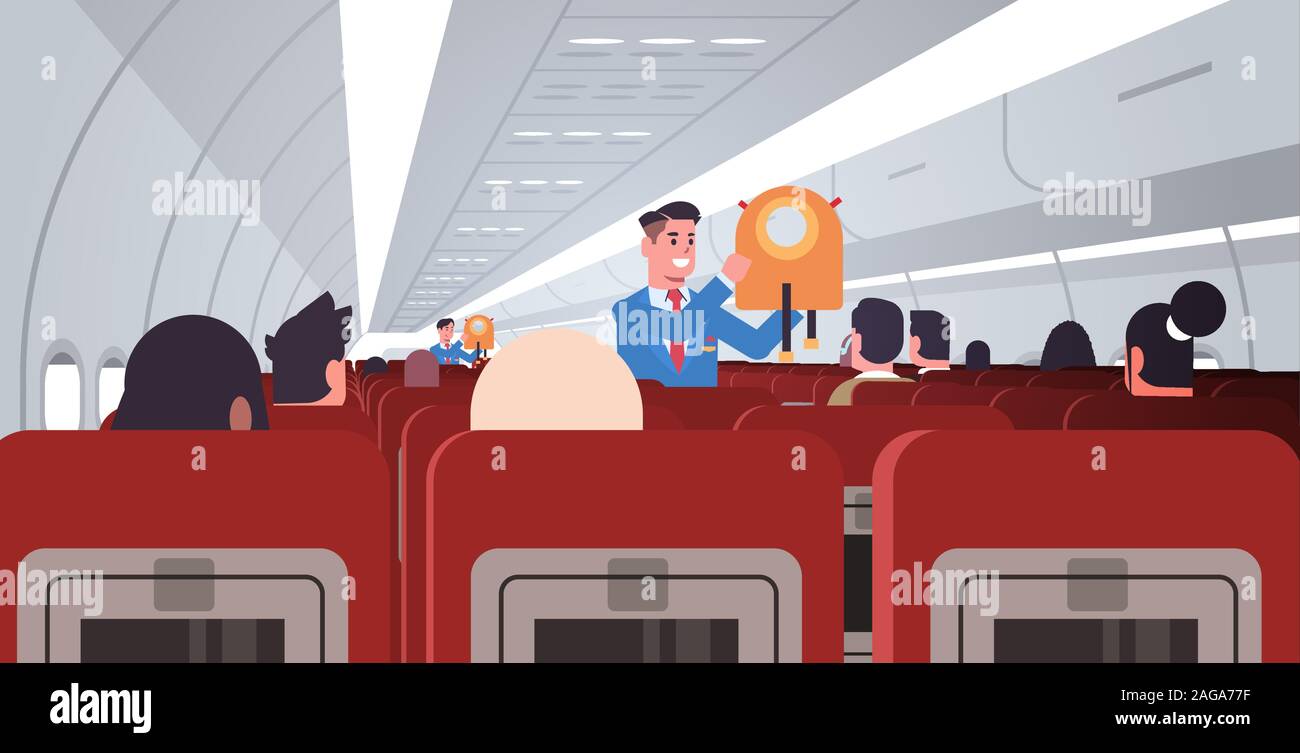 steward explaining for passengers how to use jacket life vest in ...