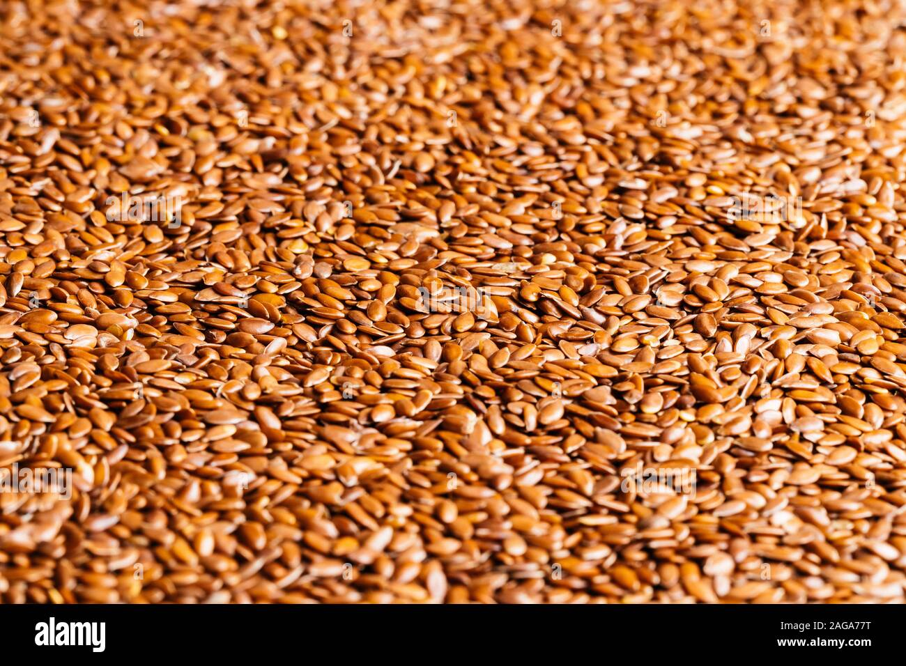 Brown raw flaxseeds background texture hi-res stock photography and ...