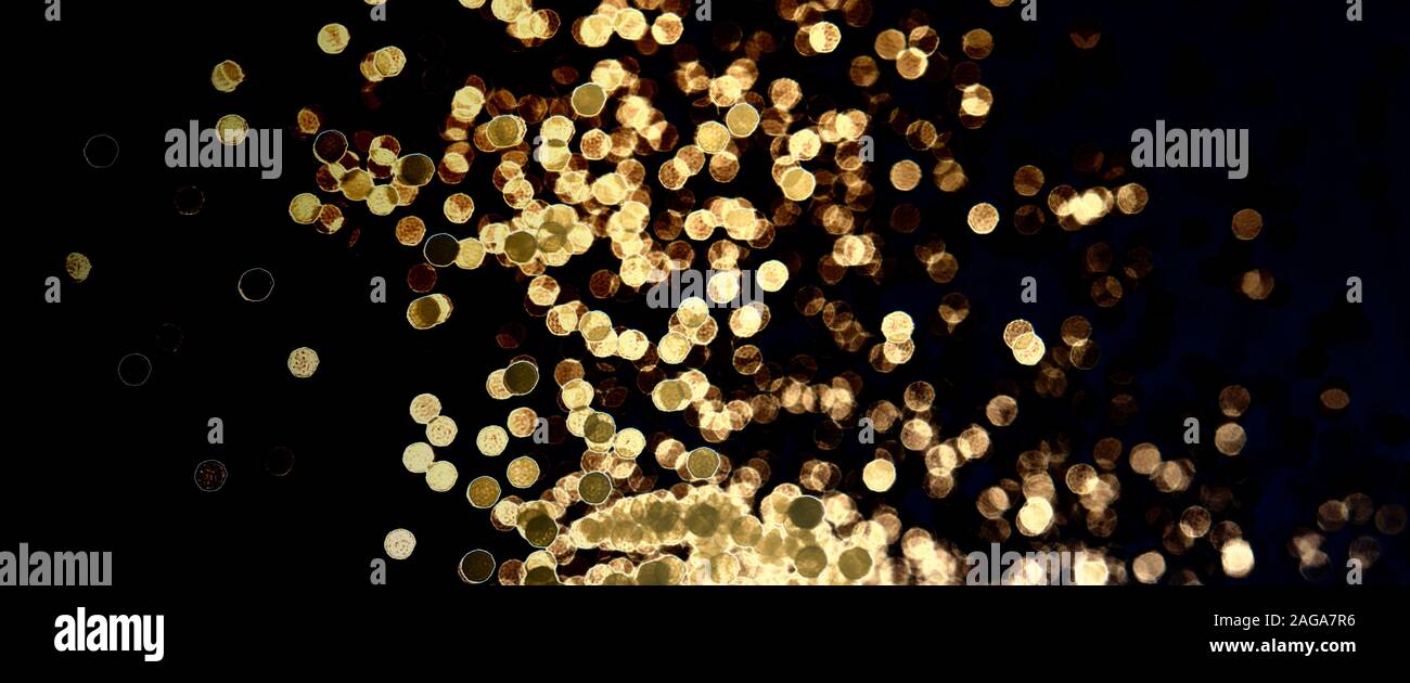 Golden lens flares on black. Abstract background Stock Photo - Alamy