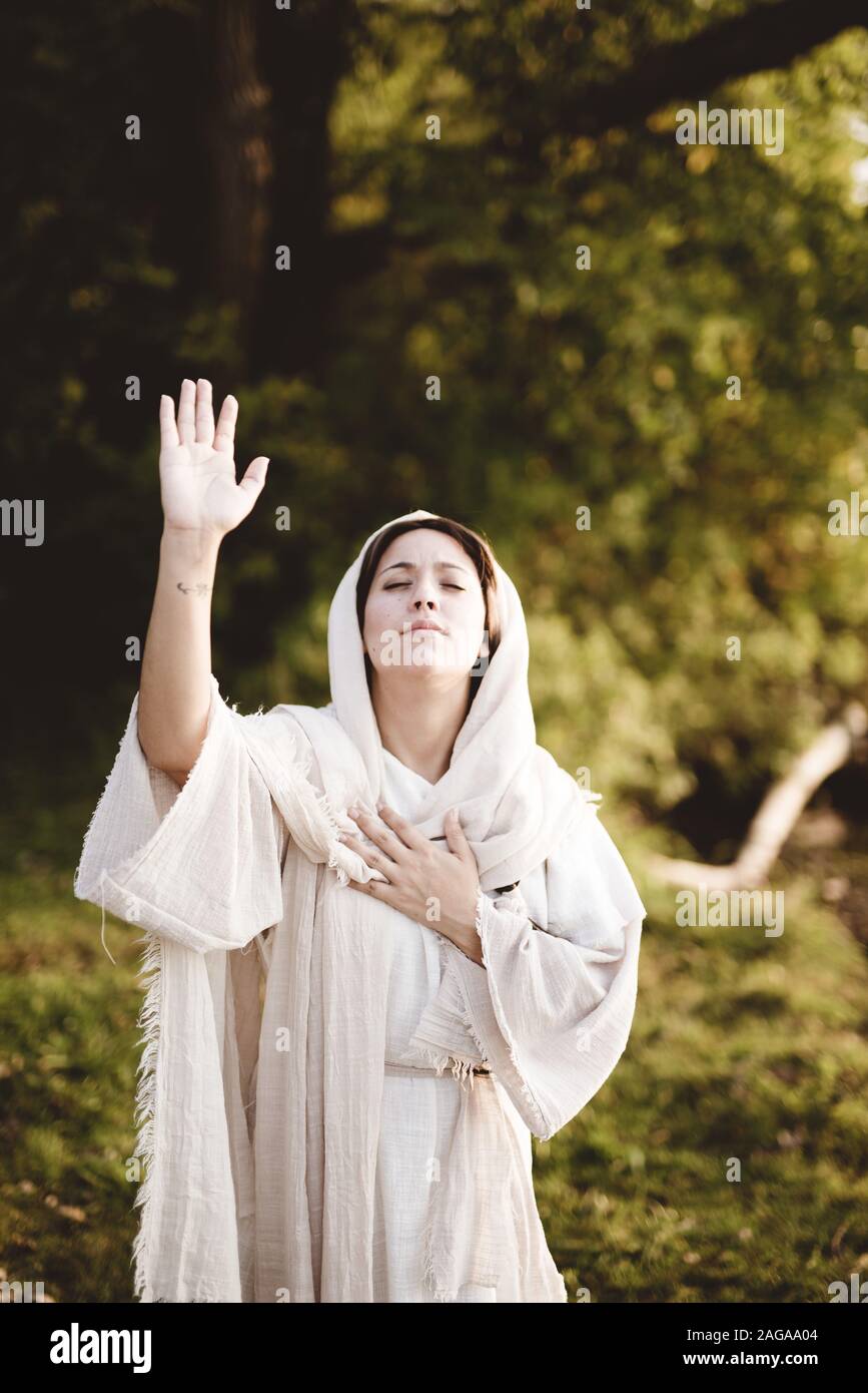 Catholic saint sculpture with praying hands hi-res stock photography ...