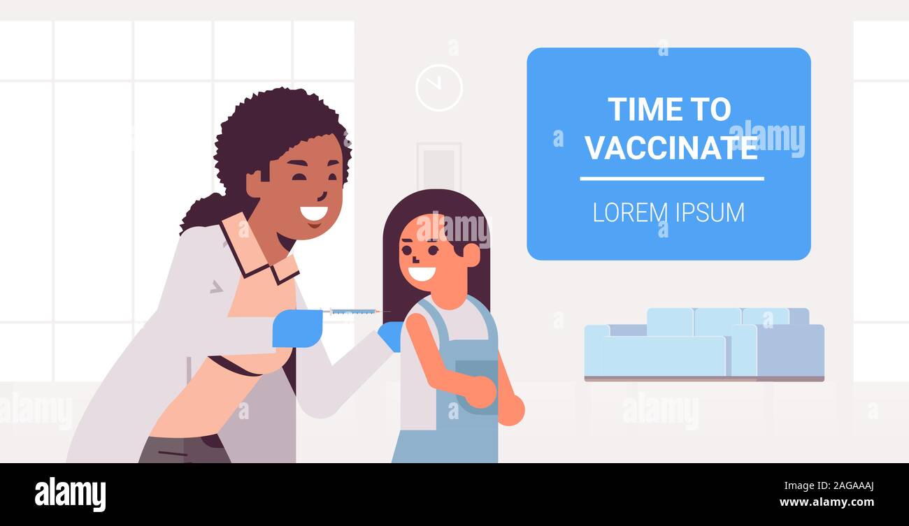 female doctor pediatrician giving vaccine injection shot to little girl ...