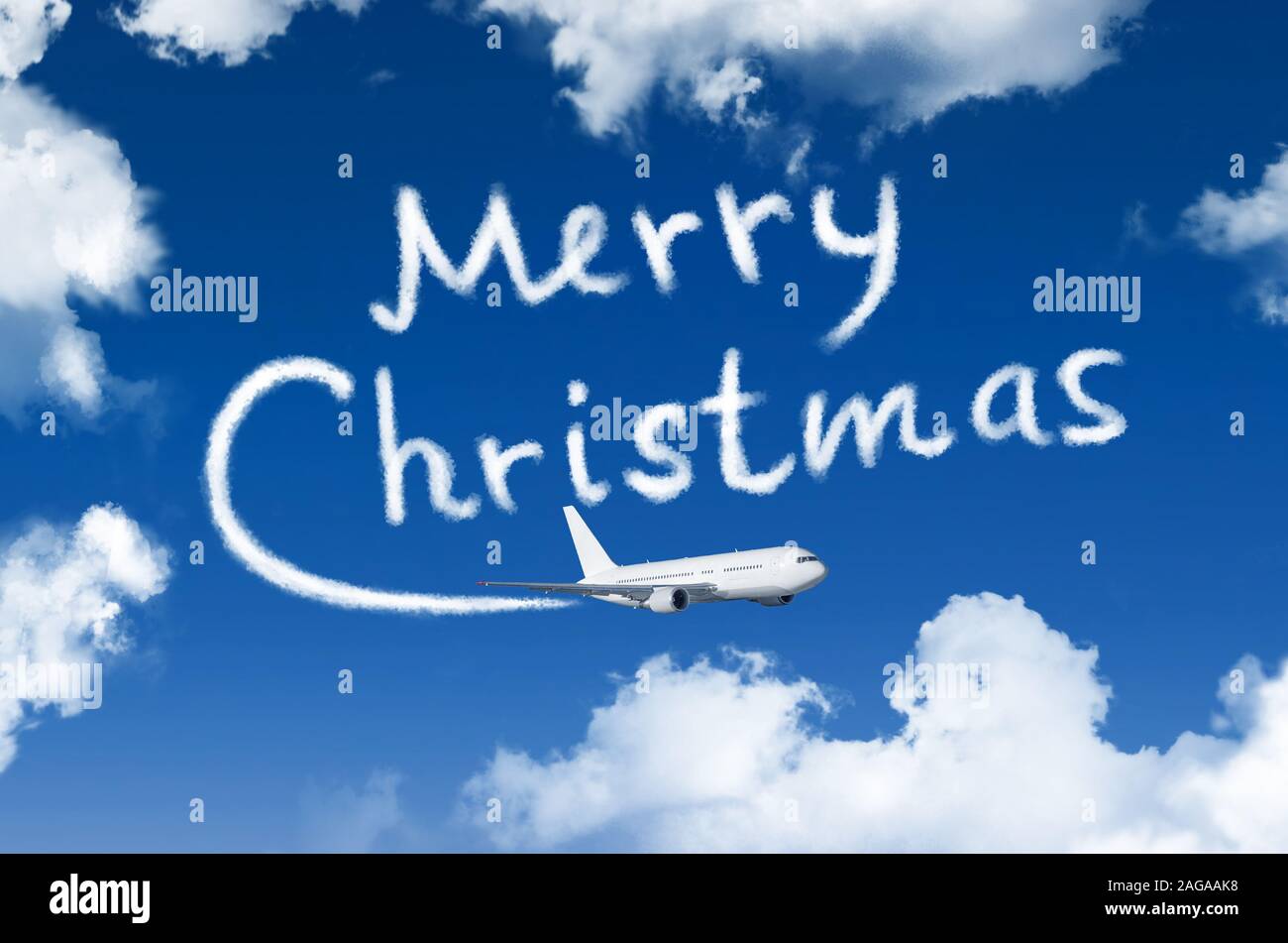 Happy Merry Christmas concept. Drawing by airplane vapor contrail in sky Stock Photo - Alamy