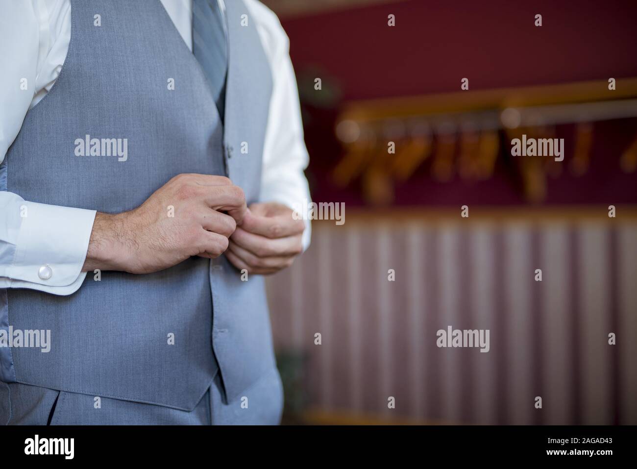 Stylish man buttoning up vest hi-res stock photography and images - Alamy