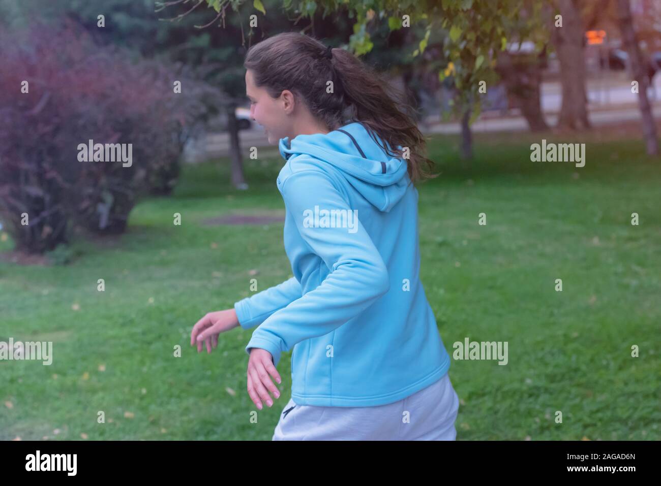 Running woman. Female fitness model training outside in the city Stock ...