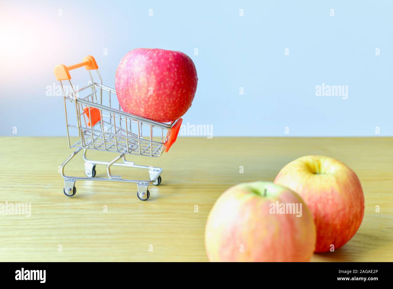 Isolated Shopping Cart Filled with Red Apple Stock Photo - Alamy