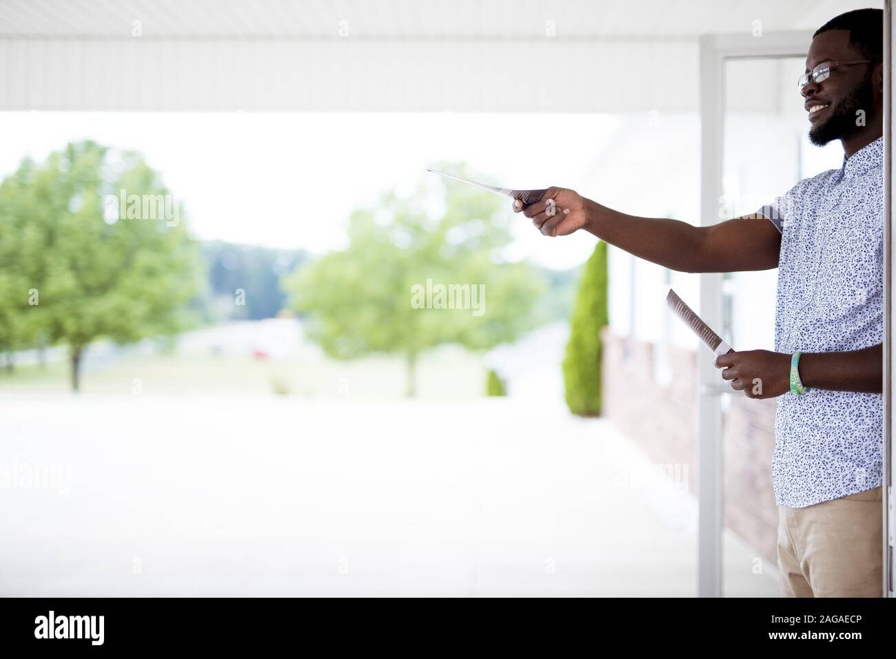 Shallow focus shot of a male standing near the church while giving out ...