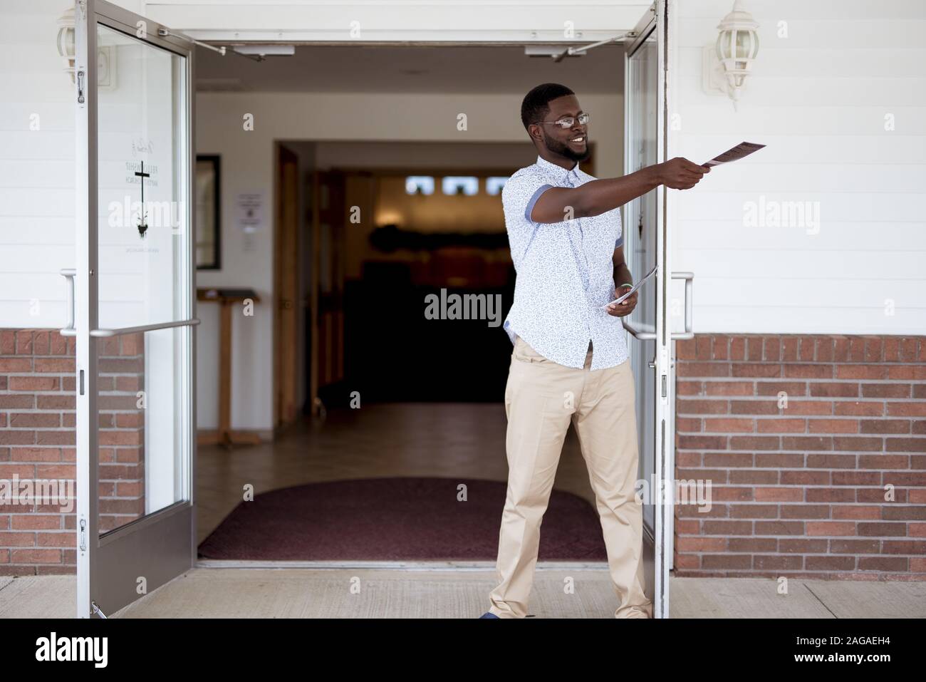 Giving out flyer hi-res stock photography and images - Alamy