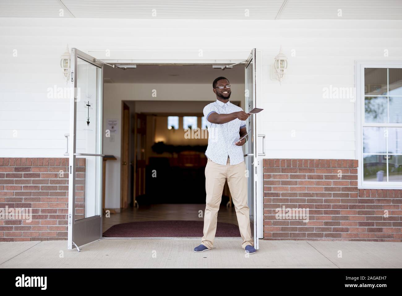 Male Standing Near The Church And giving Out Pamphlets Stock Photo Alamy male-standing-near-the-church-and-giving-out-pamphlets-stock-photo-alamy