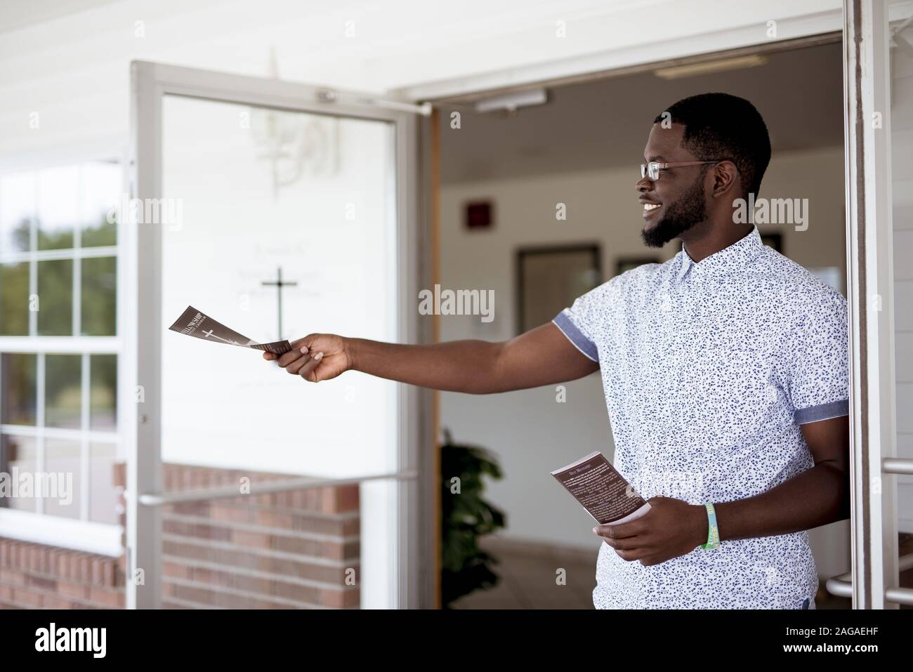 Giving out flyer hi-res stock photography and images - Alamy