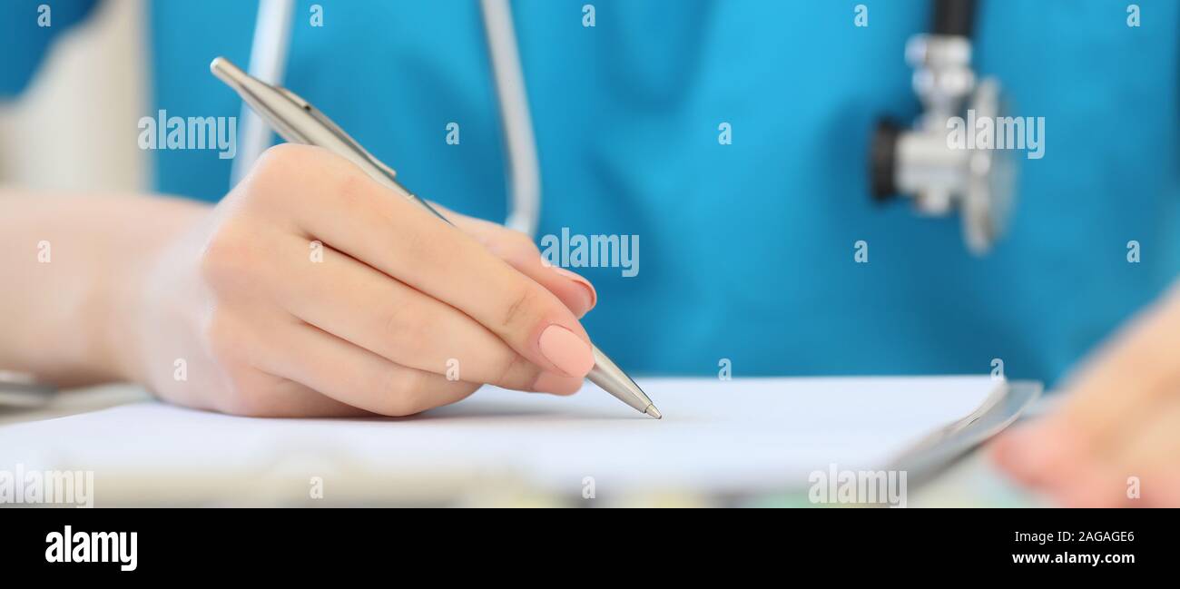Doctor hand writing prescription using hi-res stock photography and ...