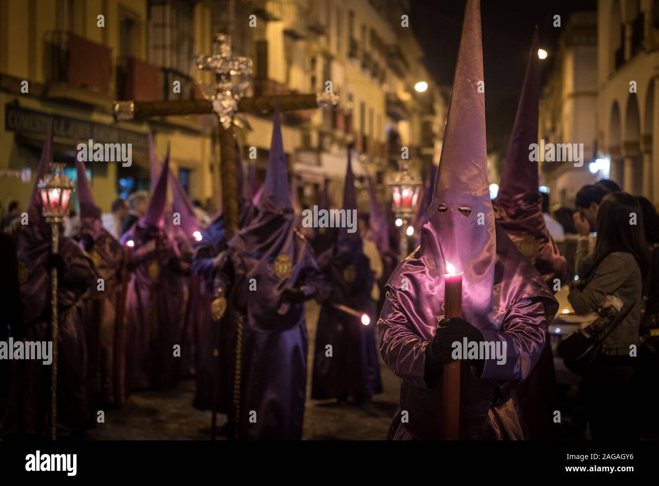 Crowd in costumes in Semana Santa Festival captured in Seville, Spain ...