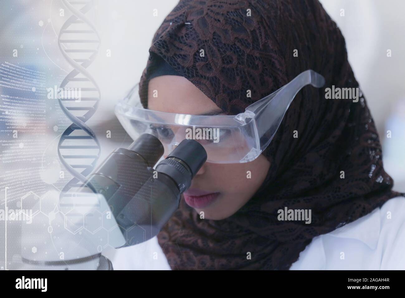 Young african muslim female scientist working at lab with test tubes ...