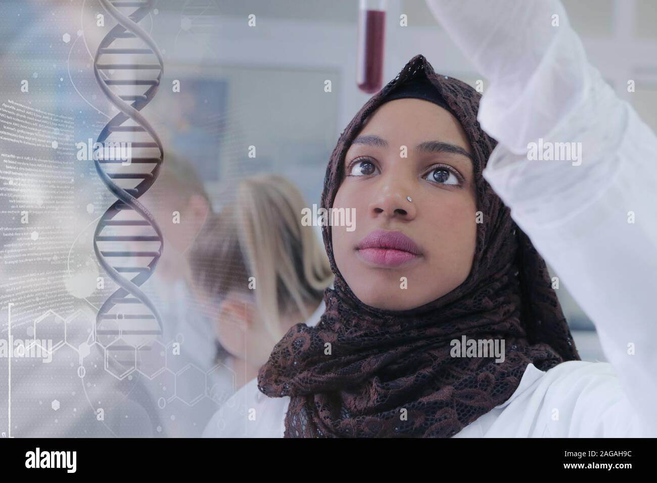 Young african muslim female scientist working at lab with test tubes ...