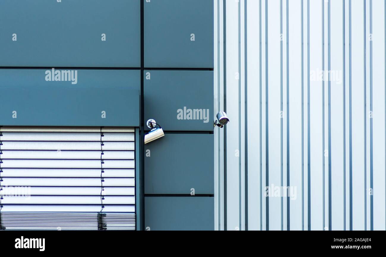 Beautiful shot of the wall of a modern building with video cameras ...