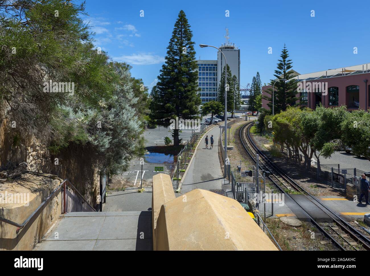 OLD STAIRS LEAD THE EYES TO TRAIN TRACKS & PORT CITY Stock Photo - Alamy