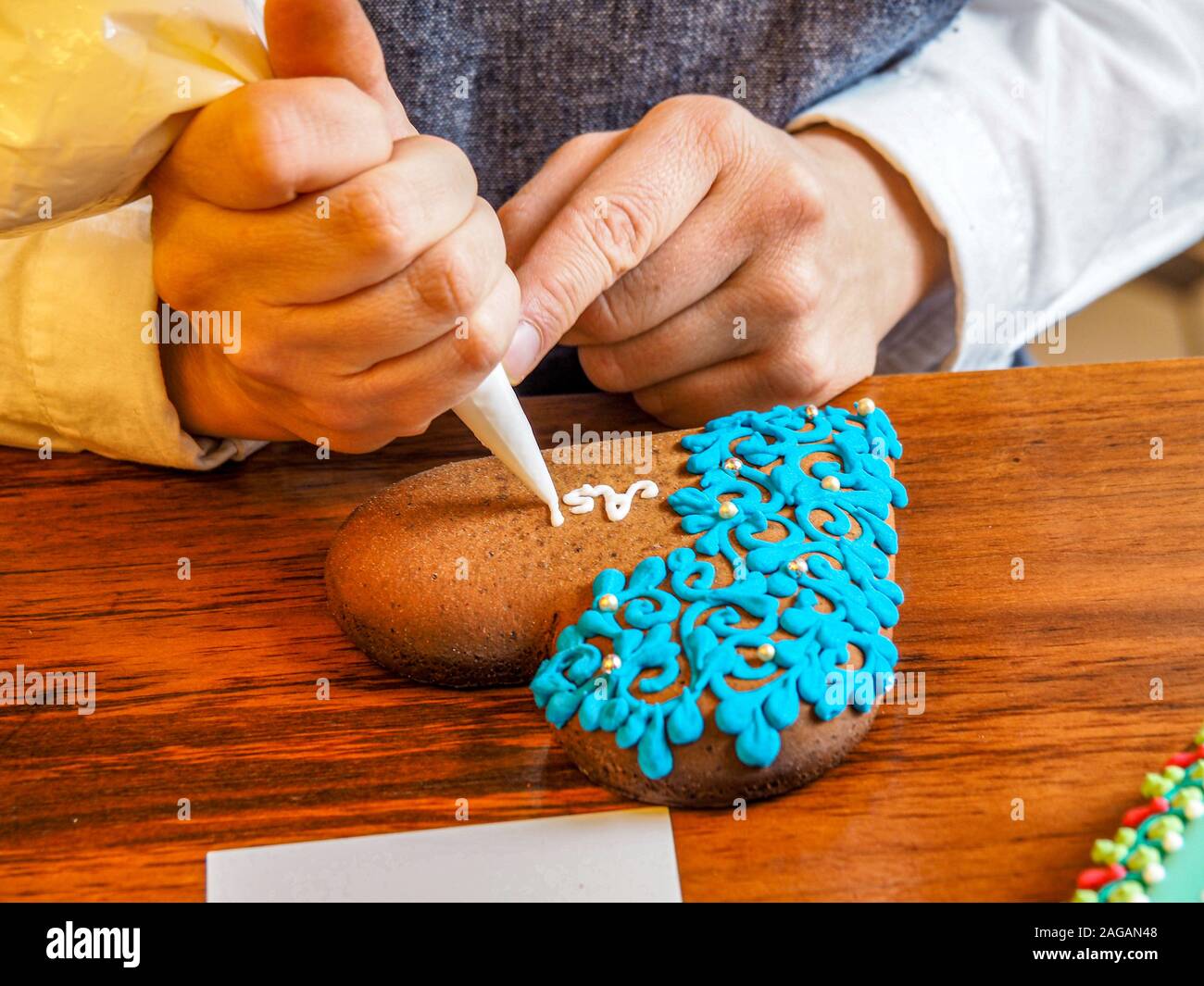 Decorating gingerbread hearts in Torun, Poland, the gingerbread capital ...