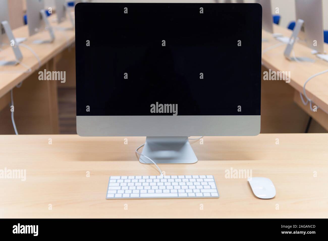 Modern office with computers on desks. Empty computer room in college ...