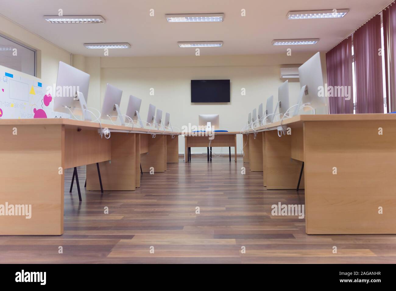 Modern office with computers on desks. Empty computer room in college ...