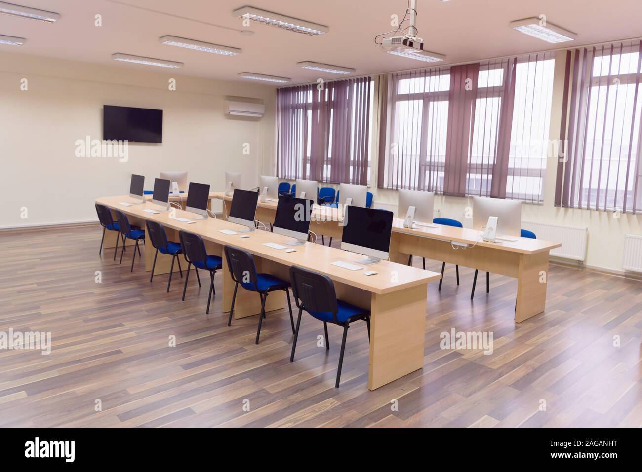 Modern office with computers on desks. Empty computer room in college ...