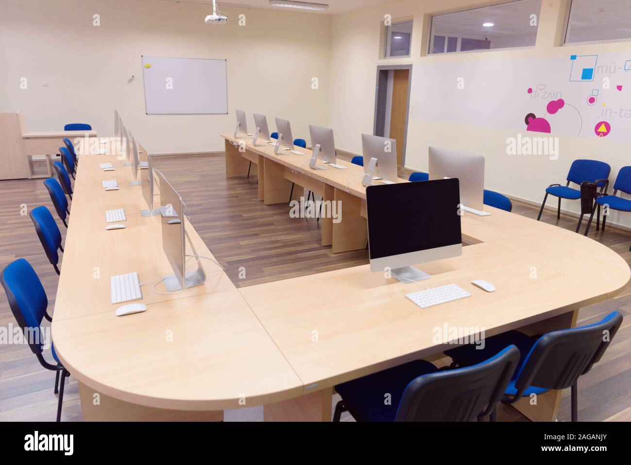 Modern office with computers on desks. Empty computer room in college ...
