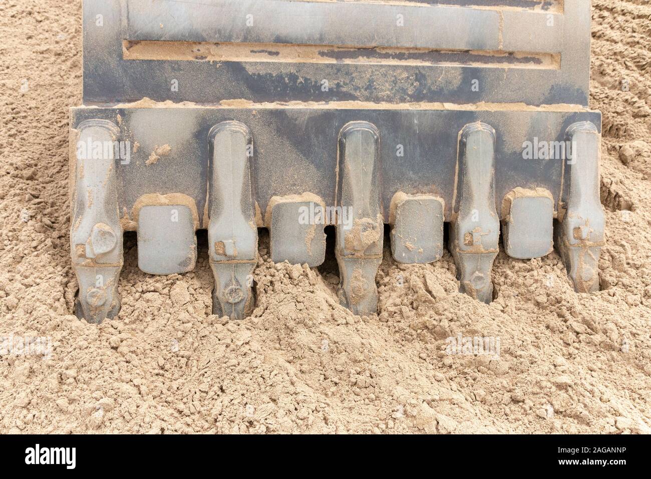 A close up view of a grader digging up sand on Durban beach Stock Photo ...