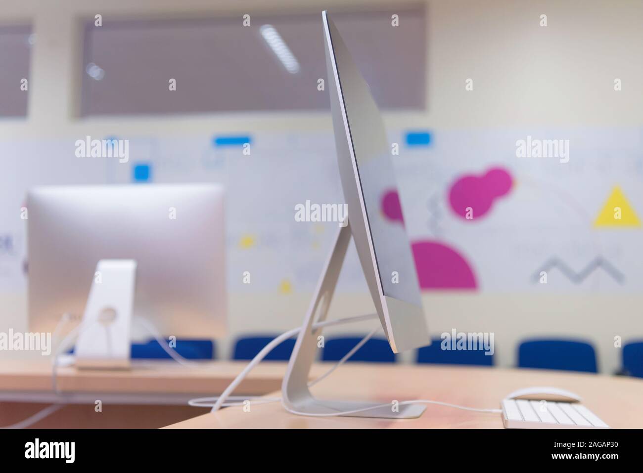 Modern office with computers on desks. Empty computer room in college ...