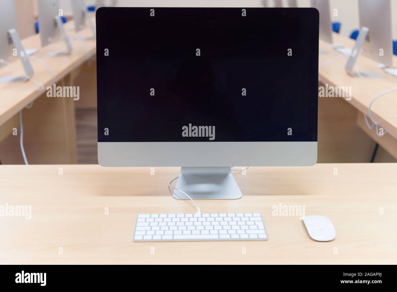 Modern office with computers on desks. Empty computer room in college ...