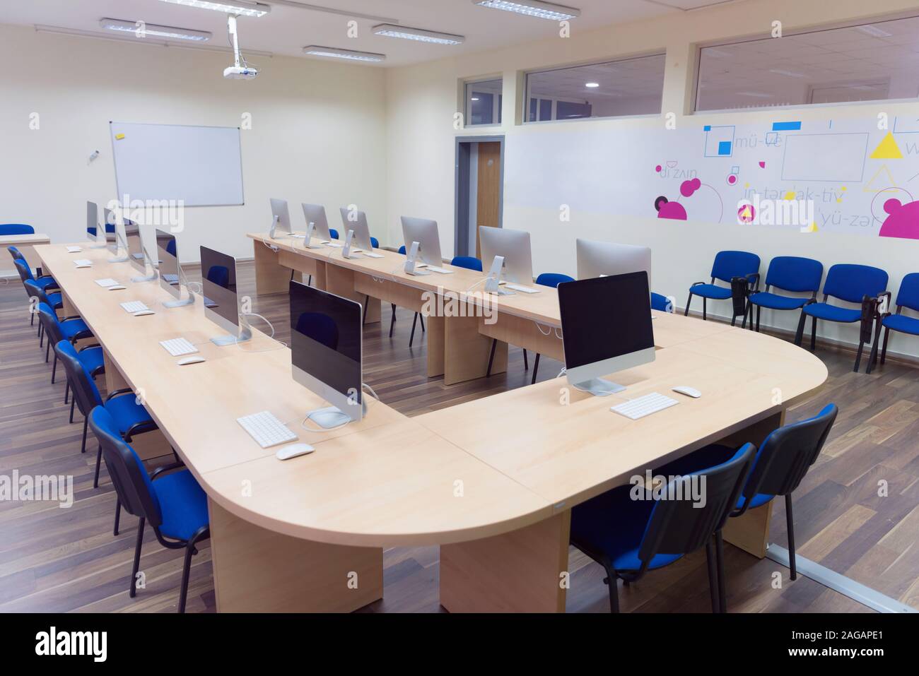 Modern office with computers on desks. Empty computer room in college ...