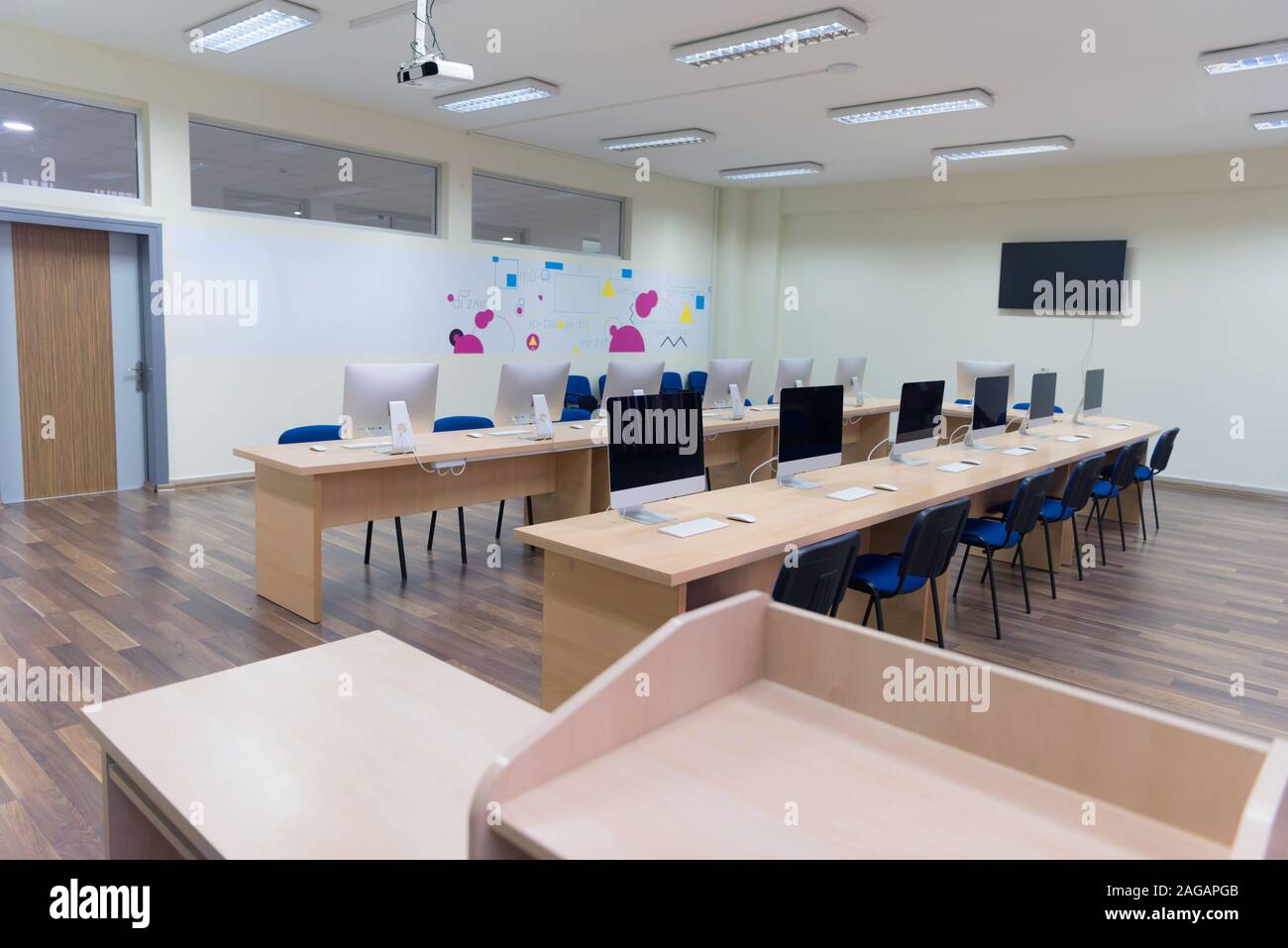 Modern office with computers on desks. Empty computer room in college ...