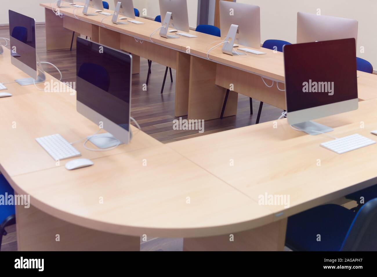 Modern office with computers on desks. Empty computer room in college ...