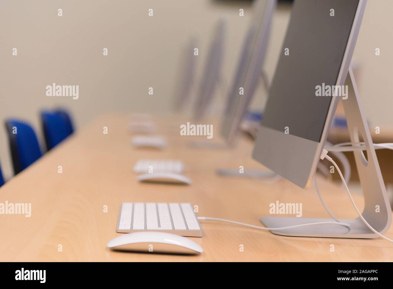 Modern office with computers on desks. Empty computer room in college ...