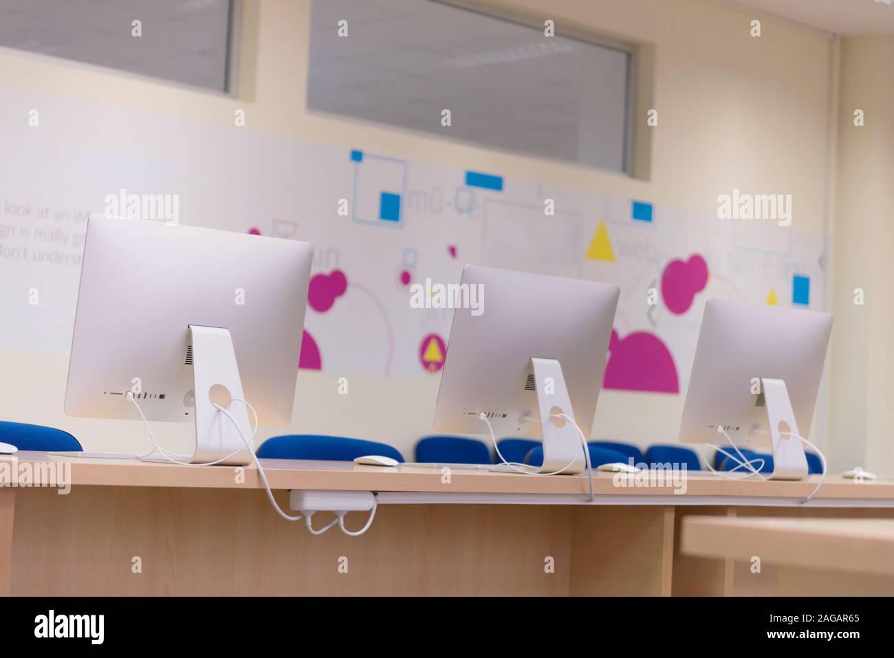 Modern office with computers on desks. Empty computer room in college ...