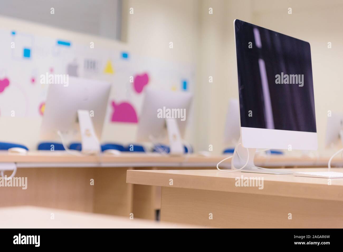 Modern office with computers on desks. Empty computer room in college ...