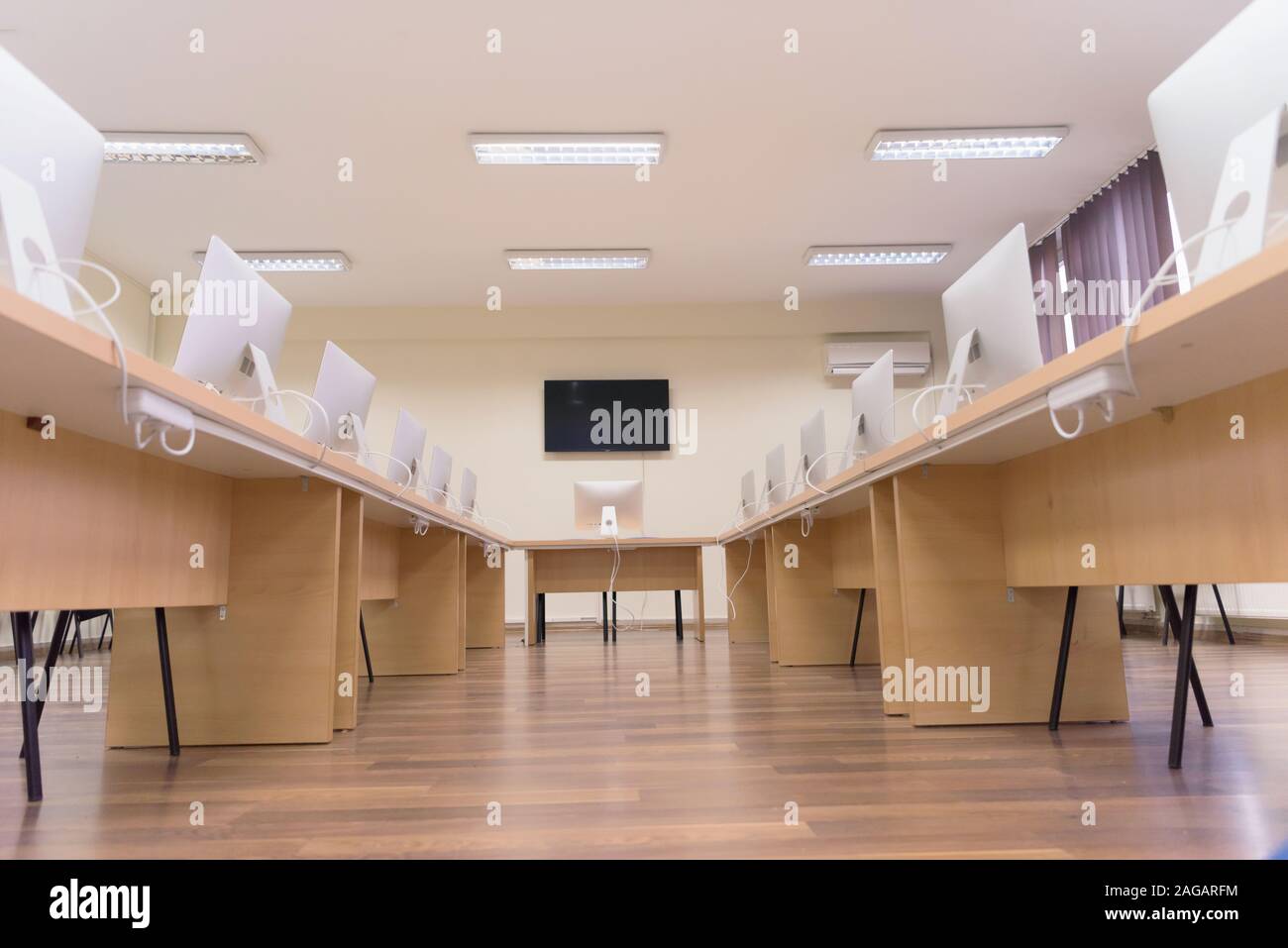 Modern office with computers on desks. Empty computer room in college ...