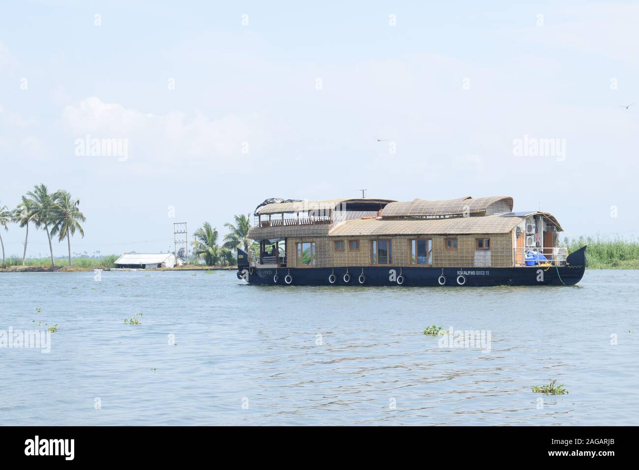 Premium Houseboat Cruises in Kerala Backwaters Stock Photo - Alamy