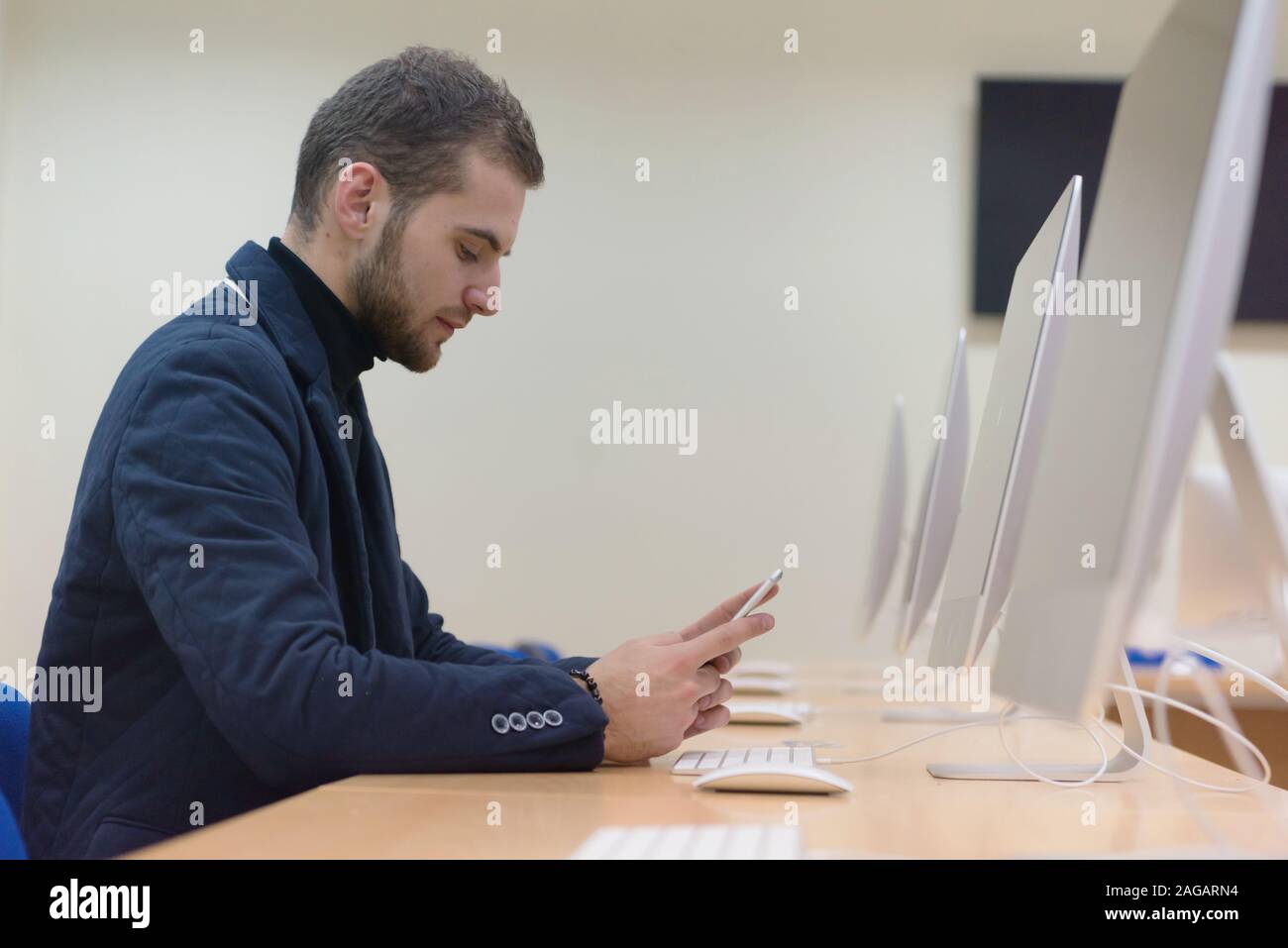 Young male Businessman working on modern computer. Businessman using ...