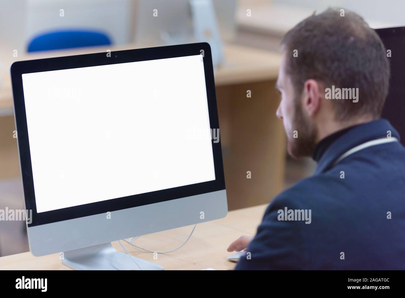 Young male Businessman working on modern computer. Businessman using ...
