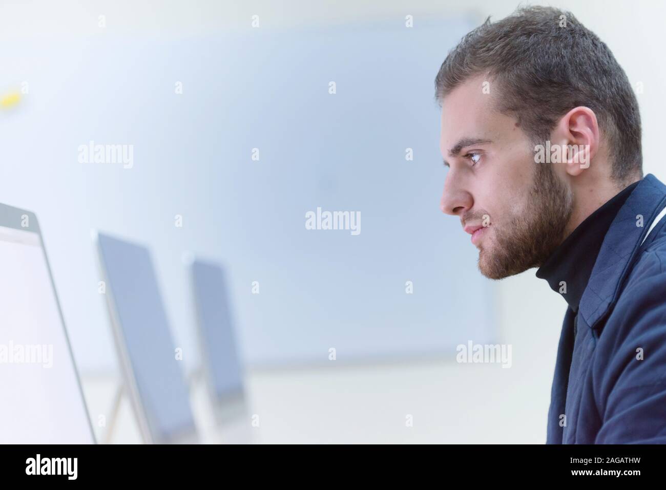 Young male Businessman working on modern computer. Businessman using ...