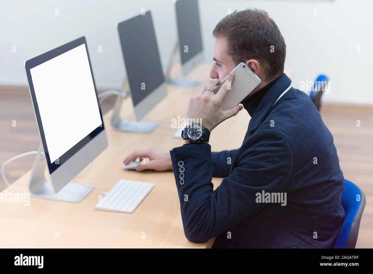 Young male Businessman working on modern computer. Businessman using ...