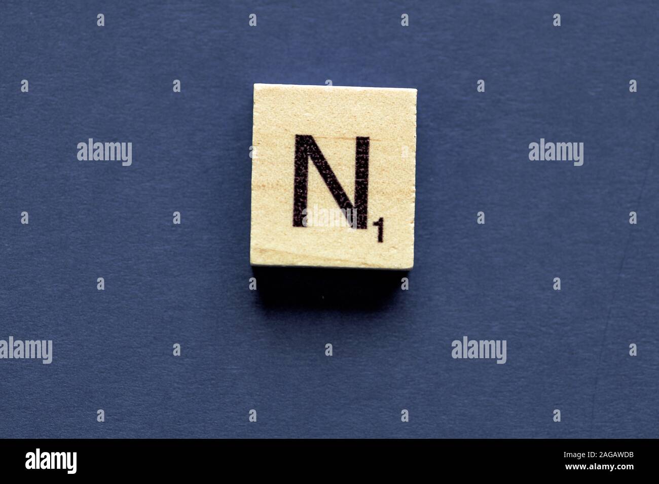 Letter N on a wooden cube from a wordplay board game Stock Photo - Alamy