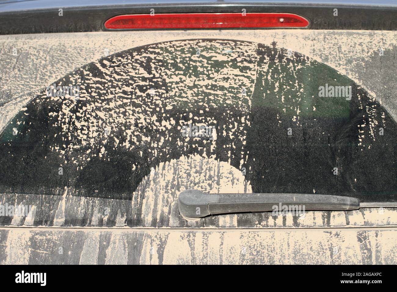 Dirty car in dust, view to the back of window Stock Photo - Alamy