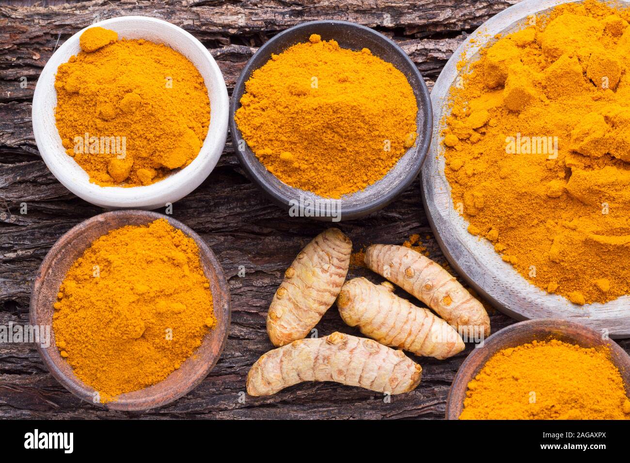 turmeric powder and roots, Asian origin plant containing curcumin has ...