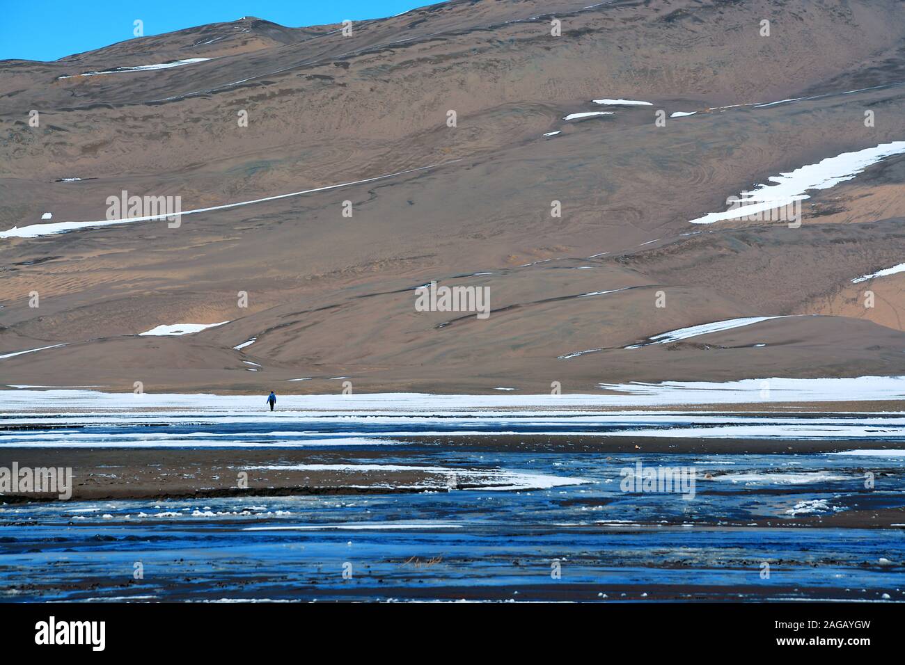 Beautiful mountainous scenery under the clear sky during the cold ...