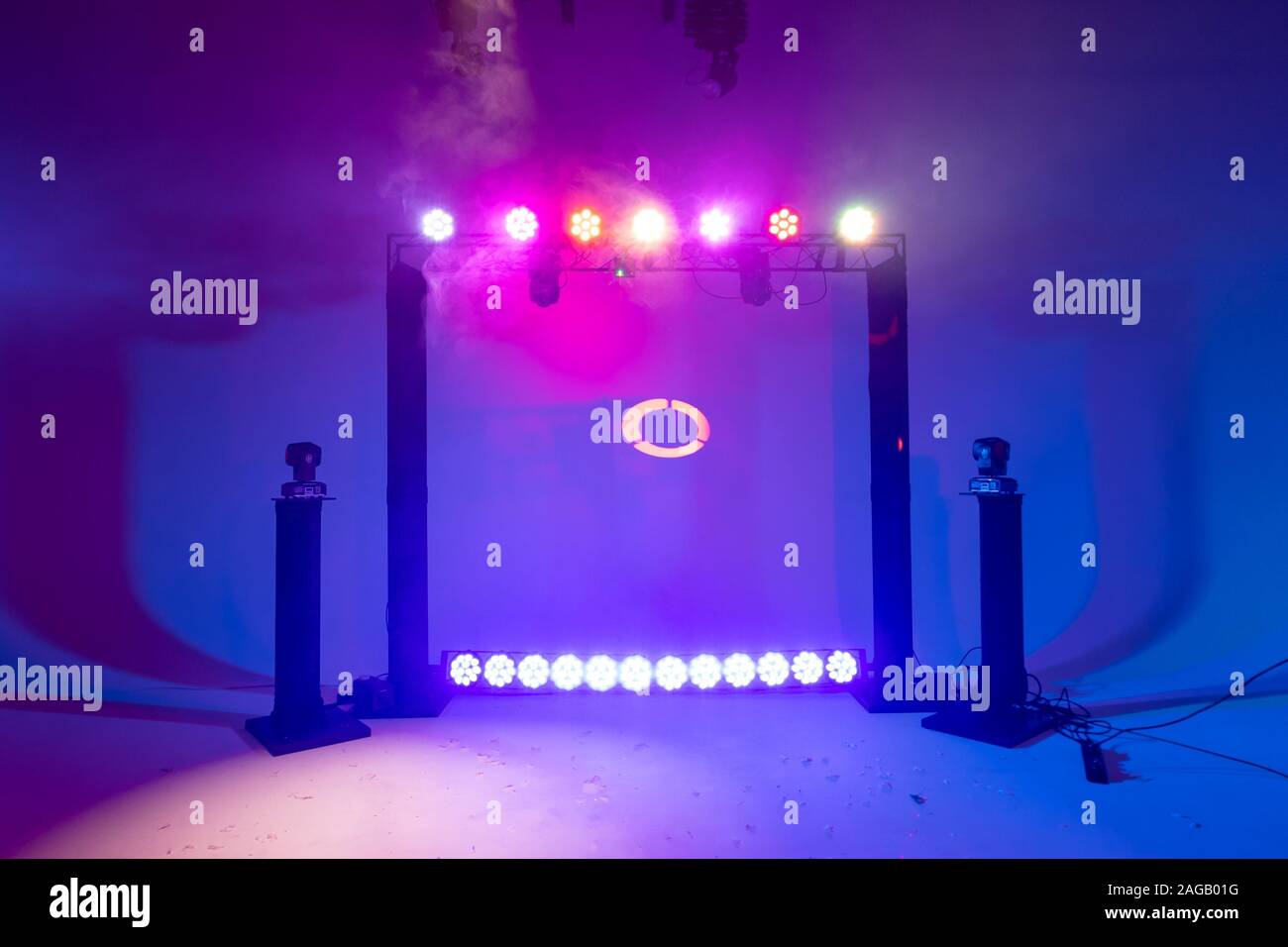 Illuminated photo backdrop with spotlights and smoke effects in a ...