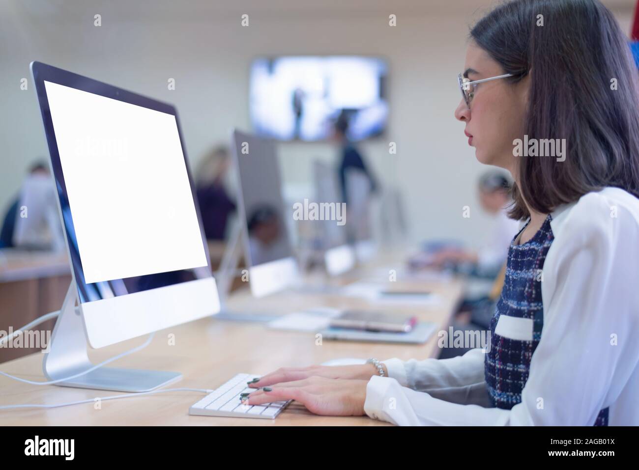 Beautiful female IT student working at her computer lab. Female student ...